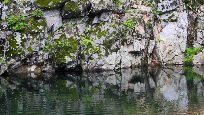 Rocks out into the lake under clouds image - Free stock photo - Public ...