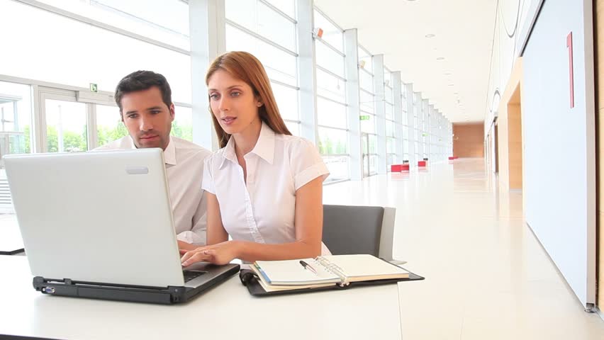Stock video of business people in front of laptop | 1155856 | Shutterstock