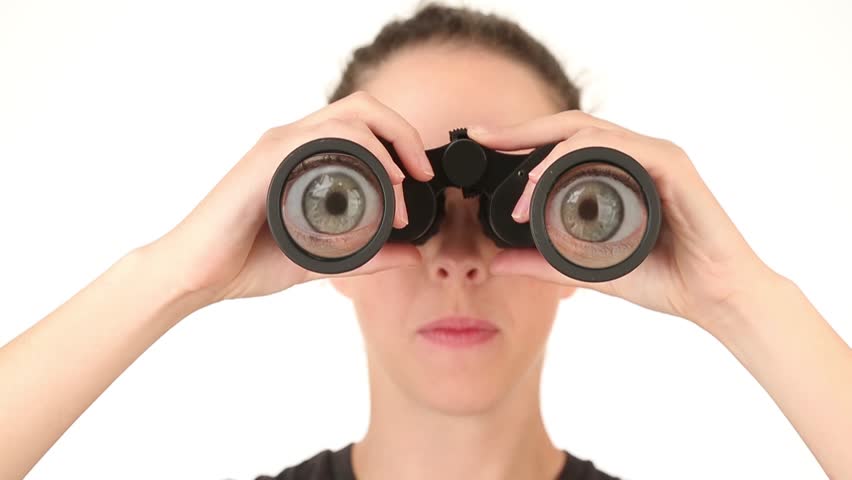 Stock video of young woman searching with binoculars, rolling ...