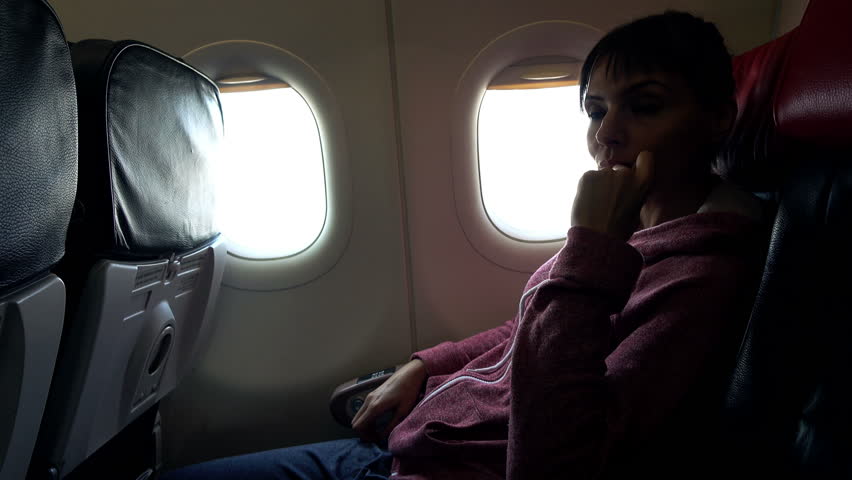 4K Asia Young Beautiful Girl Look Out Of Airplane Window During Plane ...