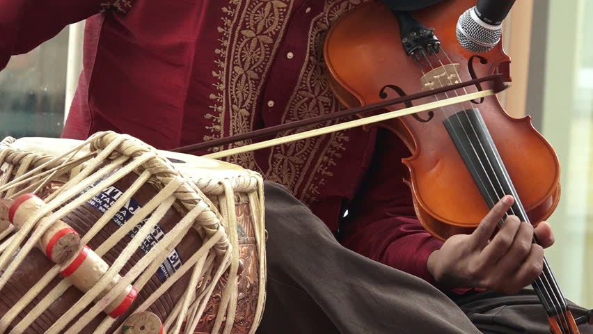 Stock Video Clip of Indian man play music on musical instrument ...