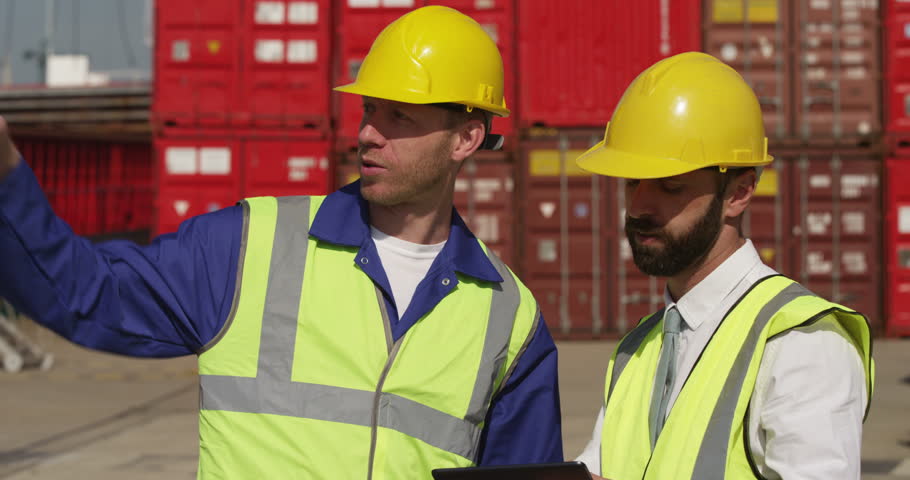 Funny Dancing Dock Worker And Engineer In Shipping Cargo Port Stock ...