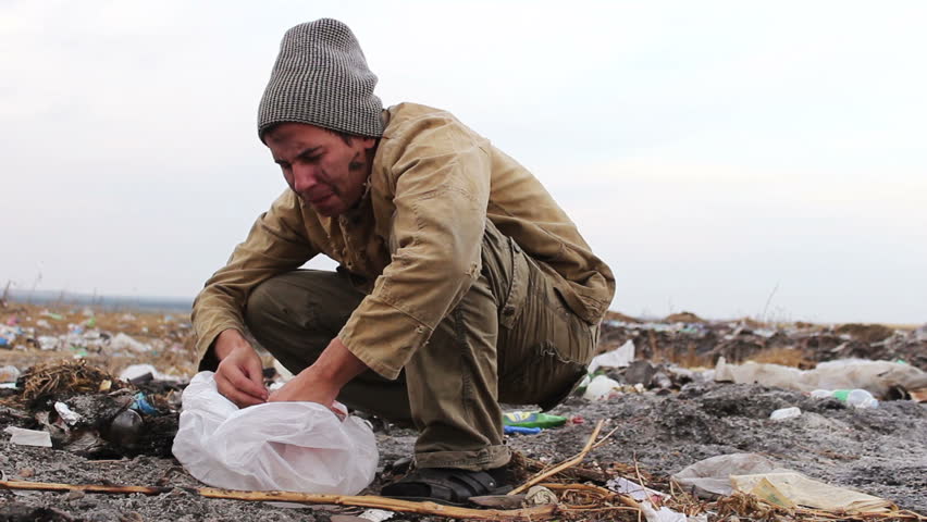 Dirty Homeless Man Sitting Closeup Clothes Cap On The Trash And Eat ...