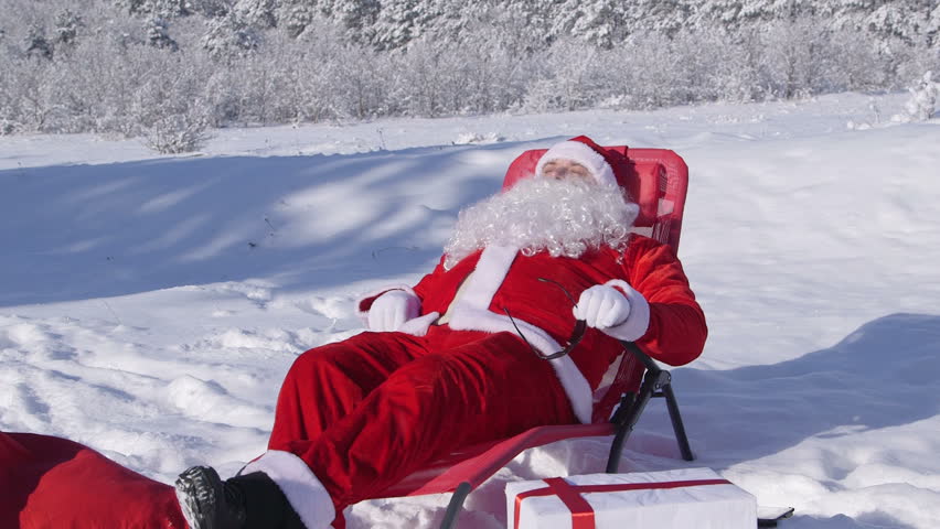 Santa Claus With Gift Bag Using Tablet Computer In Snow Covered Winter ...
