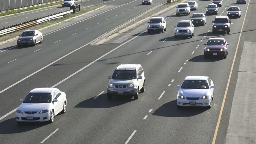 Cars Running On Highway Down Street. Four Lanes One Direction. Vilnius ...
