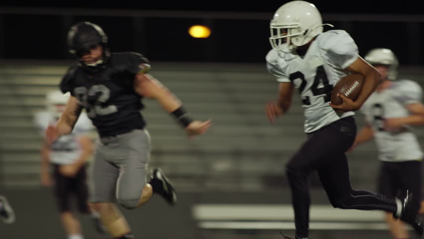 A Football Player Jumps Over Stock Footage Video (100% Royalty-free ...