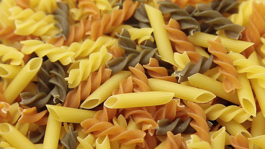 Shell Pasta Falling On White Background In Slow Motion Stock Footage ...