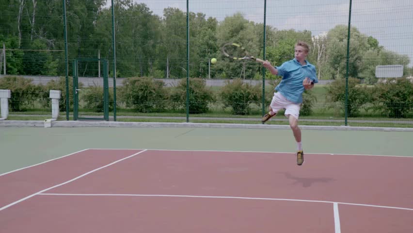 Slow Motion Of Young Women Playing Tennis. Zooming In And Out To The ...