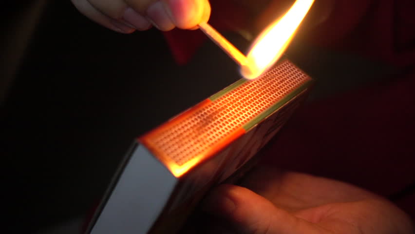 Lighting a Matchstick in Slow Stock Footage Video (100% Royalty-free ...