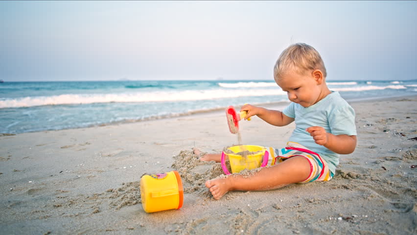 Little Kid Playing With Toy Tractor On The Beach Stock Footage Video ...