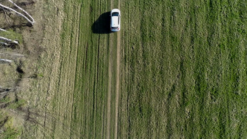 Aerial Of Tractor Mowing Grass Helicopter Satellite Top Down View From ...