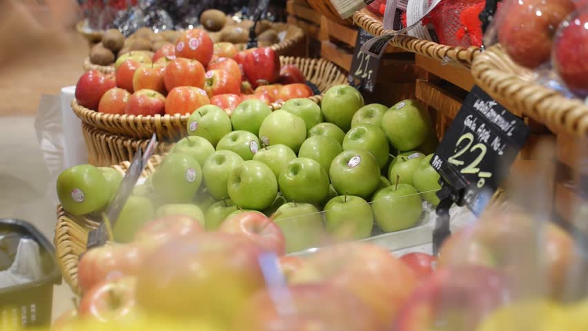 Woman Choosing Apple During Shopping Video de stock (totalmente libre ...