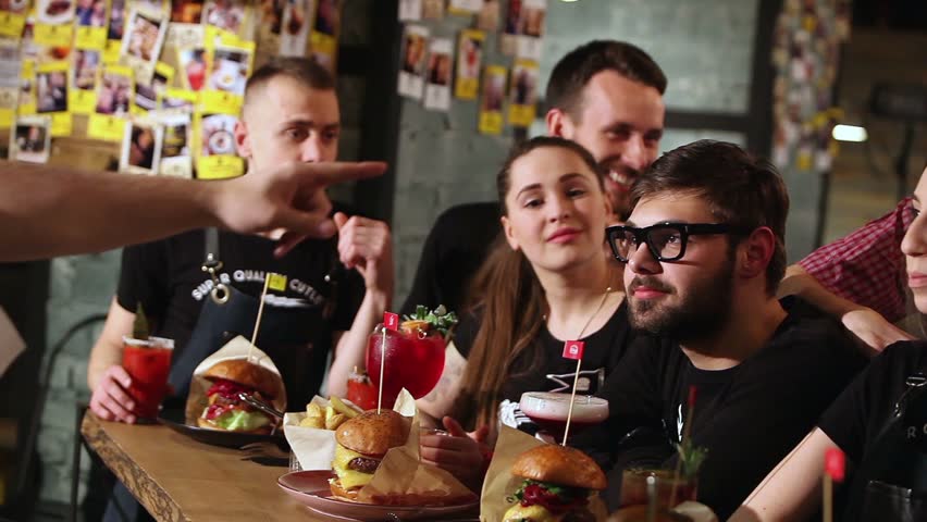 Young People At The Bar Are At The Table, The Staff Of The Restaurant ...