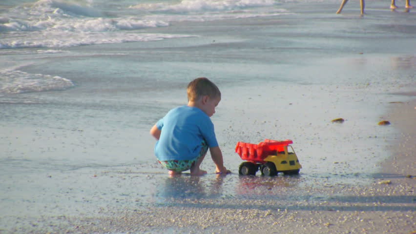 Child Picking Shells On Beach, Little Girl Playing In Sand On Seashore ...