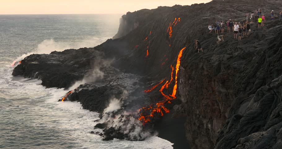 Tourist Looking At Volcanic Eruption Lava Flowing Into The Ocean. Steam ...