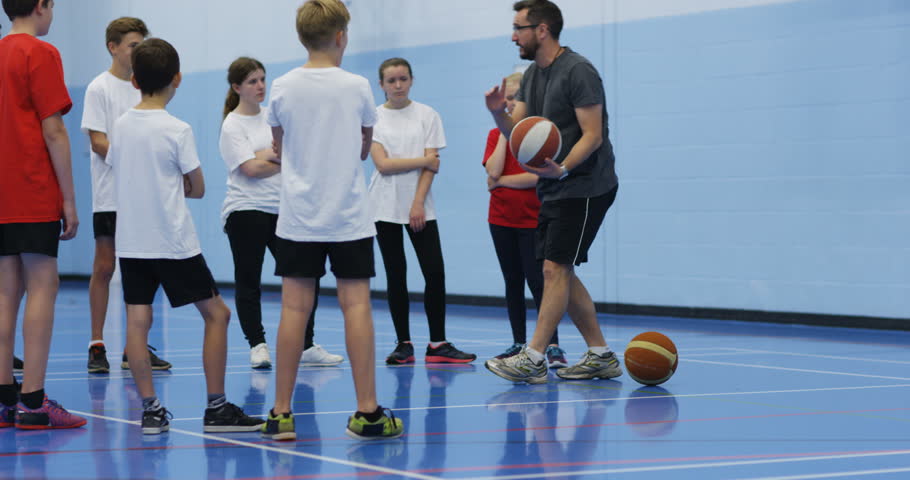 Stock Video Clip of 4K Sports teacher with young pupils on | Shutterstock