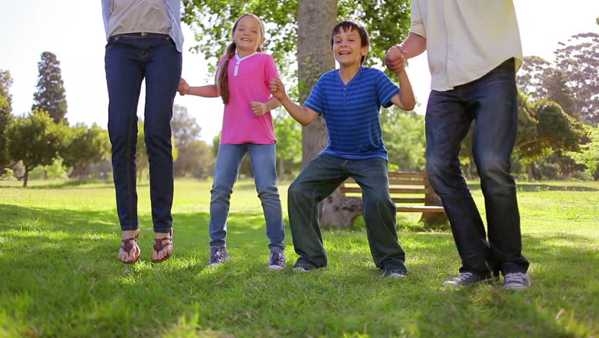 Stock video of happy family dancing together on the | 2212006 ...