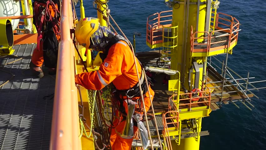KELANTAN, MALAYSIA - JAN 10 2016 : Man Working Overboard. Abseiler ...