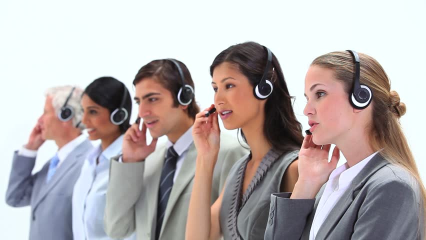 Stock Video Clip of Standing business people speaking into headset ...