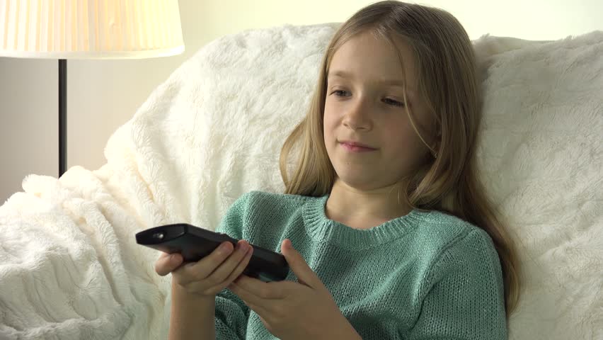 Child Watching TV, Girl With Remote Control Relaxing On Sofa, Coach In ...