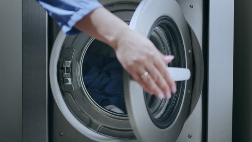 Loading Washing Machine. Load Clothes Stock Footage Video (100% Royalty ...