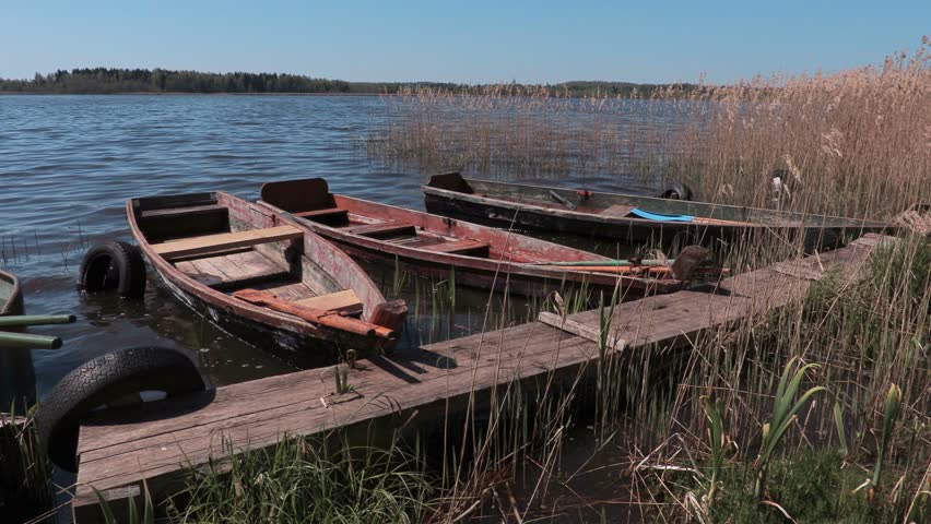 A Logging Boom Boat Is Moored Alongside A Fast Moving River/Boom Boat/A ...