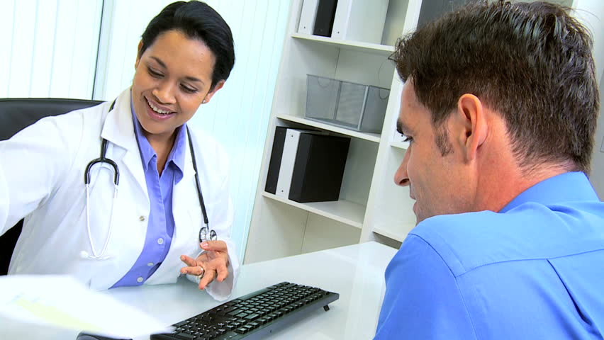 Female Hispanic Doctor Meeting Male Hospital Clinic Office Manager ...
