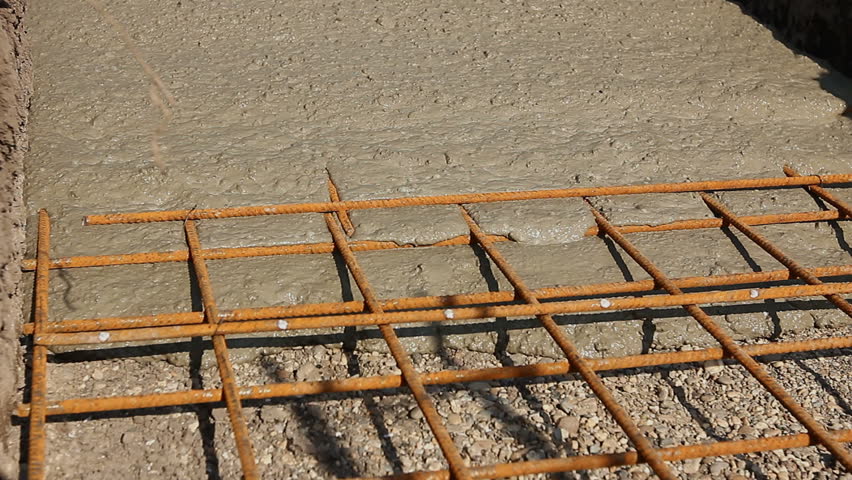Concrete Is Spreading In Foundation Over Reinforcing Steel Bars ...
