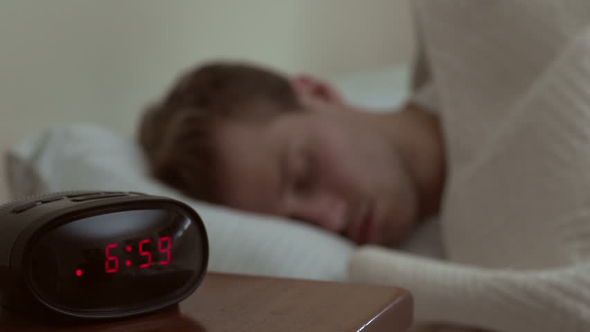 Stock video of man waking up to his alarm | 2782786 | Shutterstock