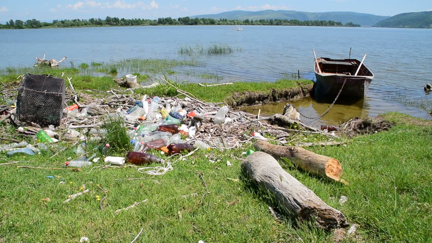 A Bunch Of Garbage That The River Washed At The Shore Stock Footage ...