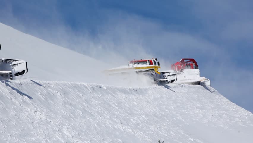 Bulldozer Pushing Deep Snow Off Mountain Road Near Forest In Central ...