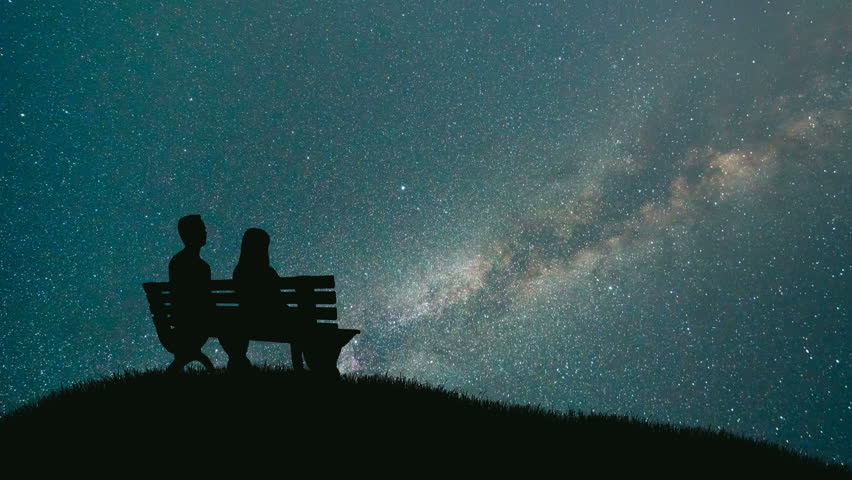 The Man Sit Against The Background Of Starry Sky. Time Lapse Stock ...