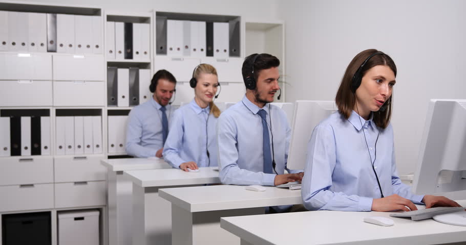 Stock video of helpful multiracial telesales team work talking ...