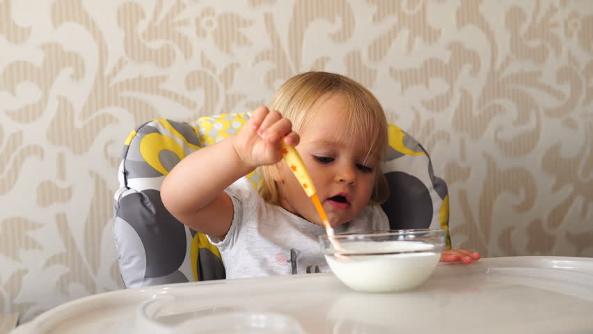 Little Girl Eats Corn On The Cob At The Outdoor Dining Table. Family ...