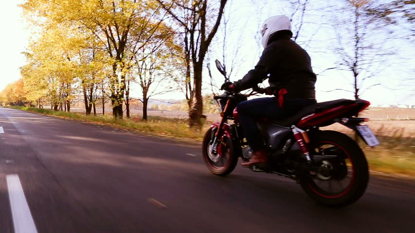 Man Riding Motorcycle On Country Road Scenery In Background Slow Motion ...