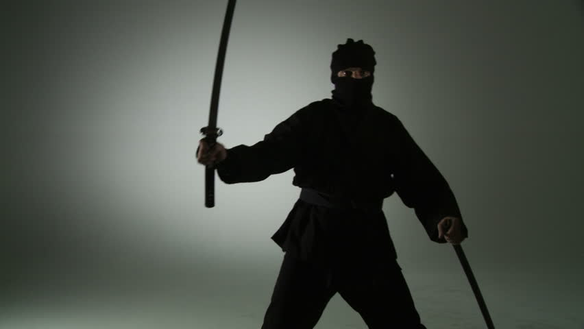 Stock video of masked ninja assassin unsheathes a sword | 3746246 ...