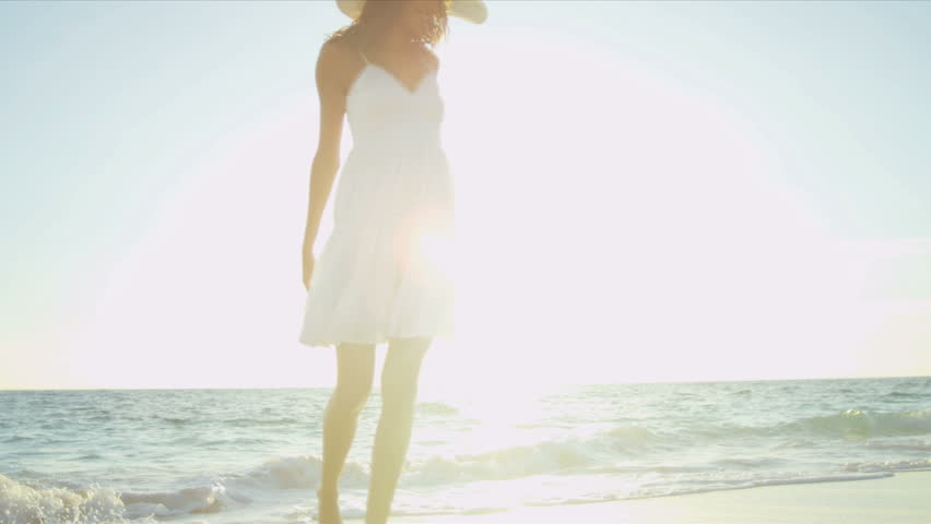 Pretty Girl In Sundress Reveling Being Alone By Ocean At Sunrise On ...
