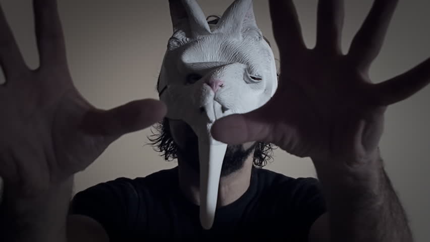 An Evil Man (a Crazy Maniac, A Psycho Killer) Wearing A Scary Bunny ...