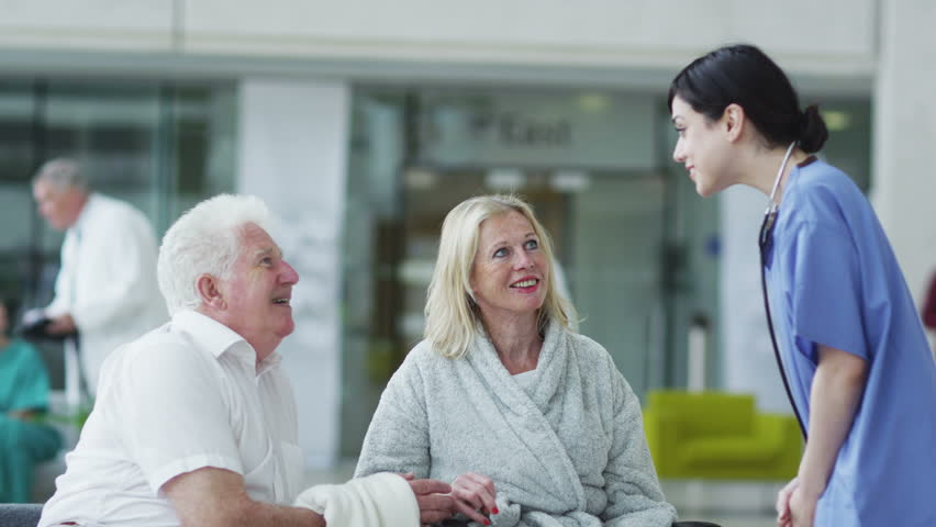 Woman Comforted By Caring Medical Staff. Assisting People When Life ...