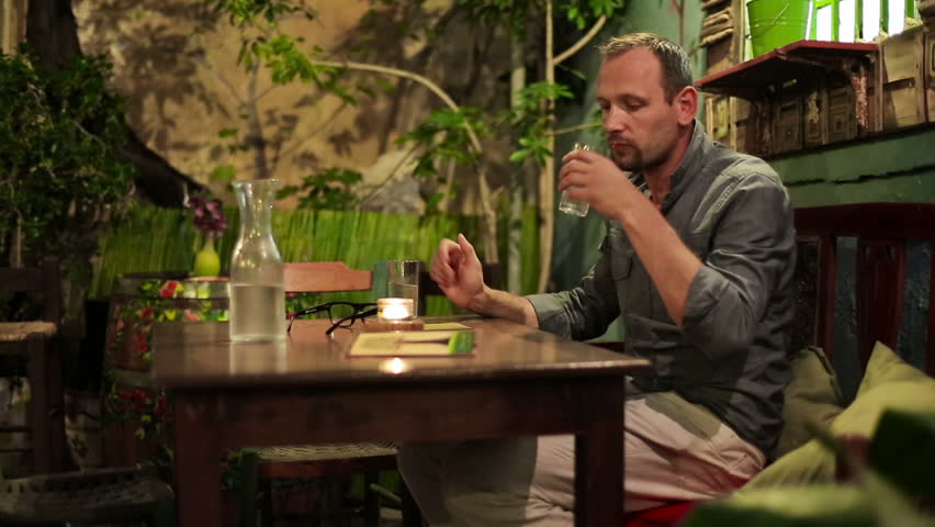 Young Sad, Lonely Man Waiting For Someone In Bar, Night Time Stock ...