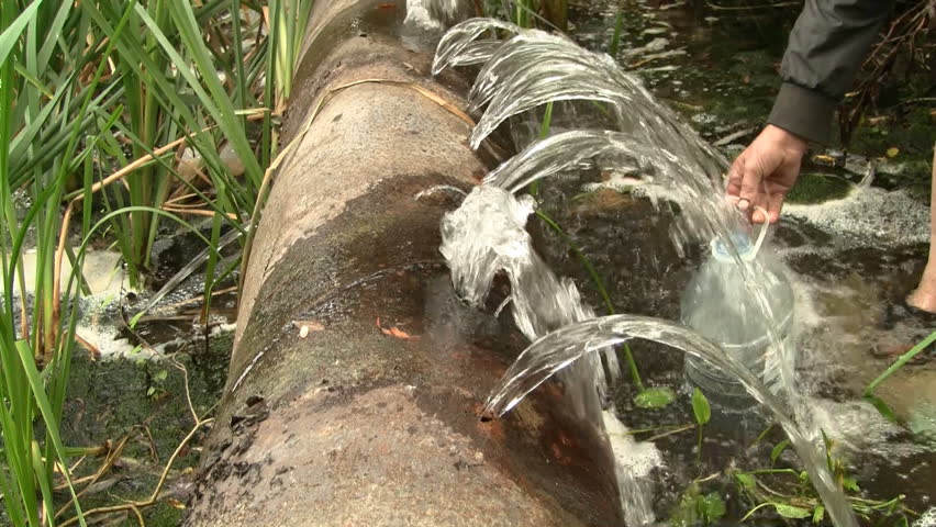 Stock video of homeless person stealing water leaking from | 4683776 ...