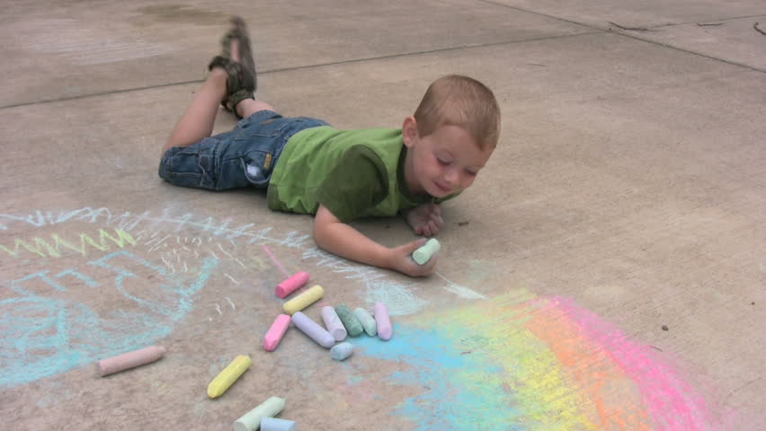 Little Boy Drawing And Coloring By Chalk On The Ground Stock Footage ...