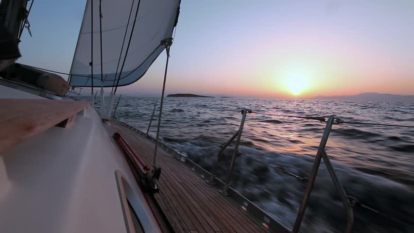 Sailing In The Wind Through The Waves During Sunset (HD) Sailing Boat ...