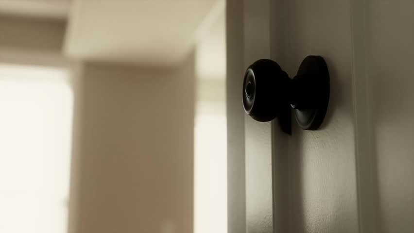 A Hand Twisting A Door Knob And Opening A Door Stock Footage Video ...