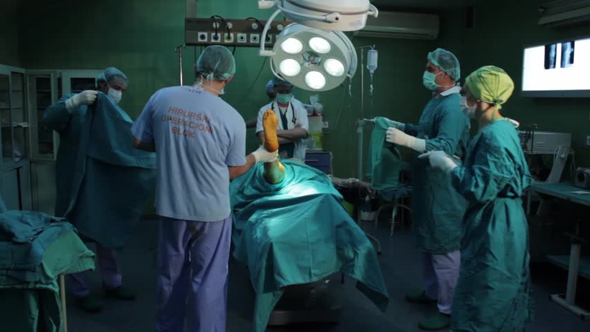 Surgeons Team Performing Surgical Operation, Cesarean Section In ...