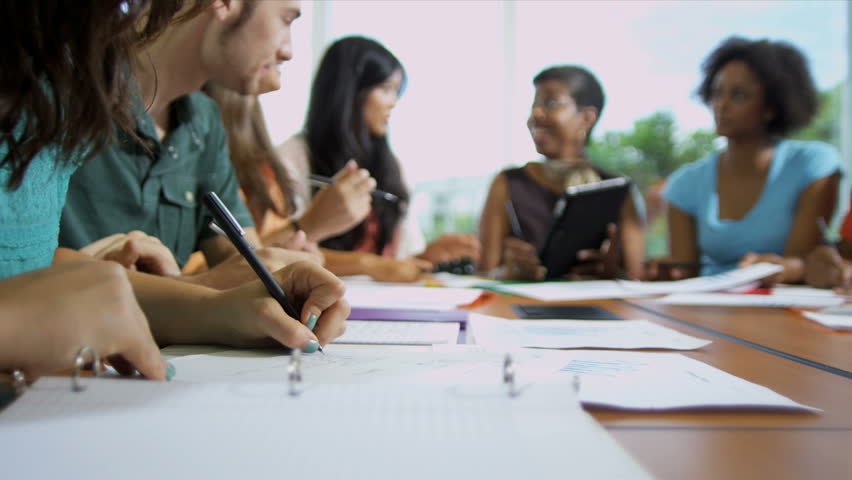 Young Multi Ethnic Boys And Girls College Students Classroom On Campus ...