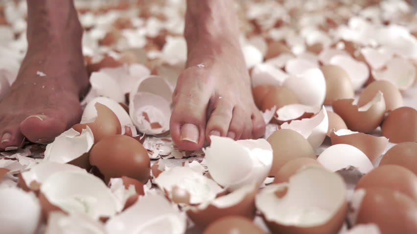 Feet Standing On A Floor Covered In Broken Egg Shells. Stock Footage ...