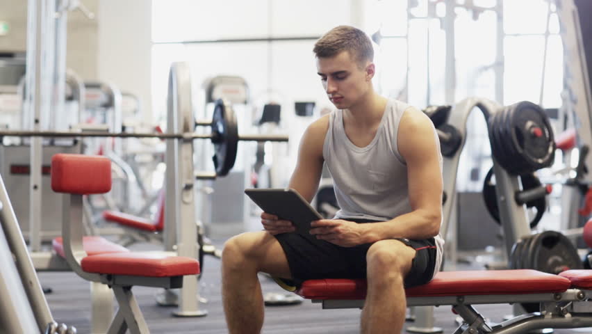 Sport, Bodybuilding, Lifestyle, Technology And People Concept - Young ...