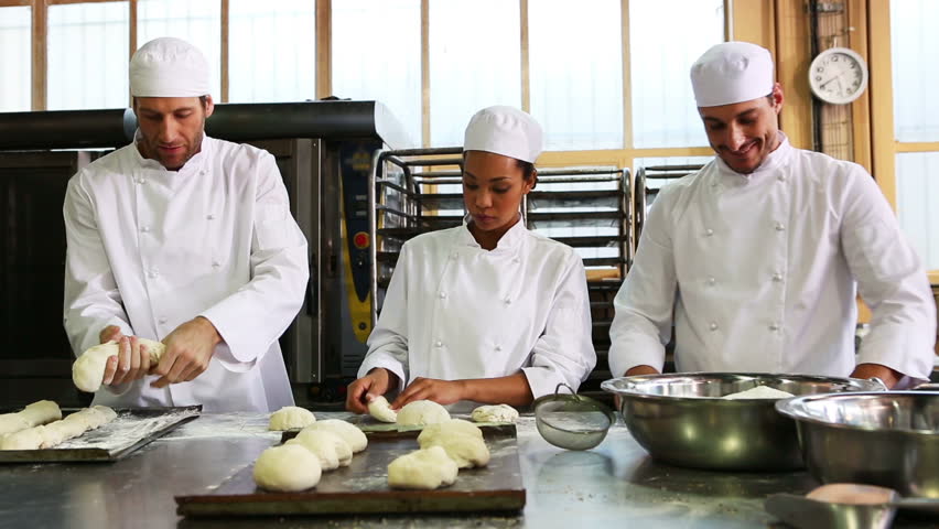 Team Of Bakers Working Together In Commercial Kitchen Stock Footage ...