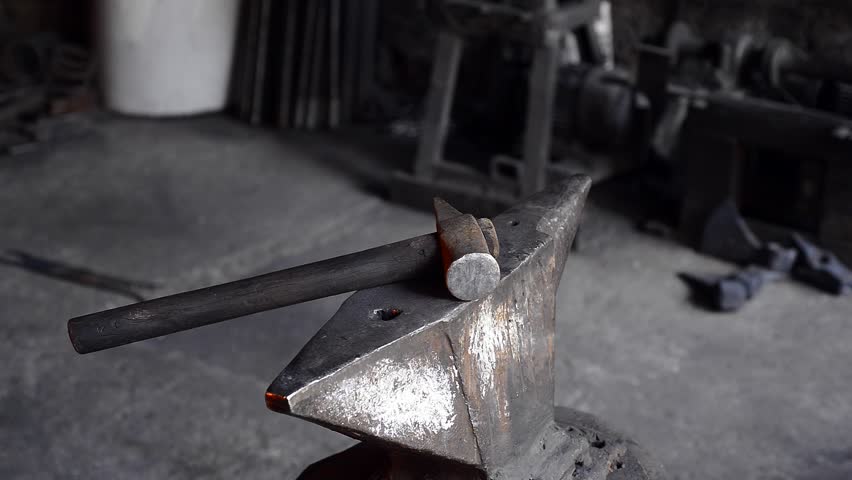 A Blacksmith In China Using Modern Machine To Forge The Iron To A Knife ...